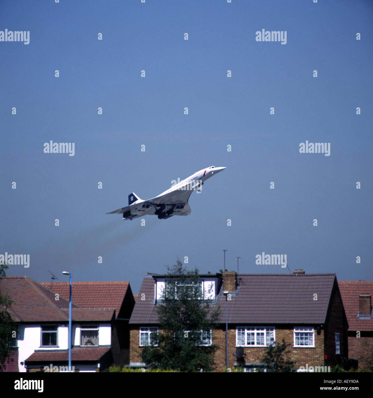 British Airways Concorde in flight above rooftops 1995 Stock Photo - Alamy