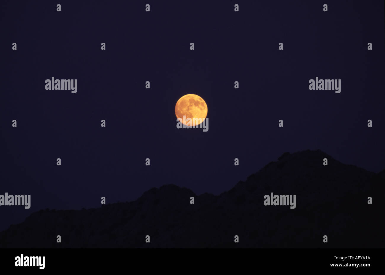 Full moon above montains of Hydra Greece Stock Photo - Alamy