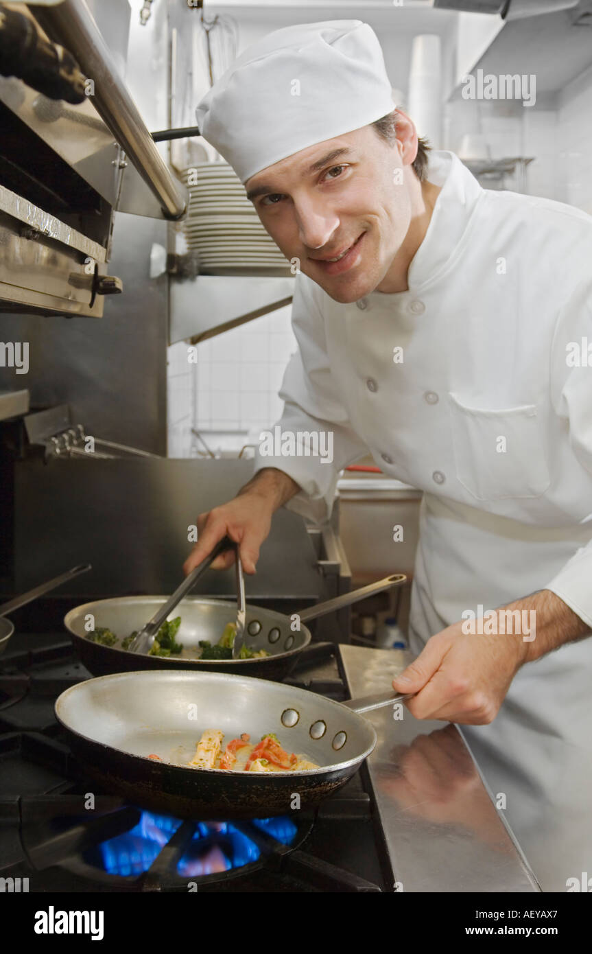 Male chef in restaurant kitchen Stock Photo - Alamy