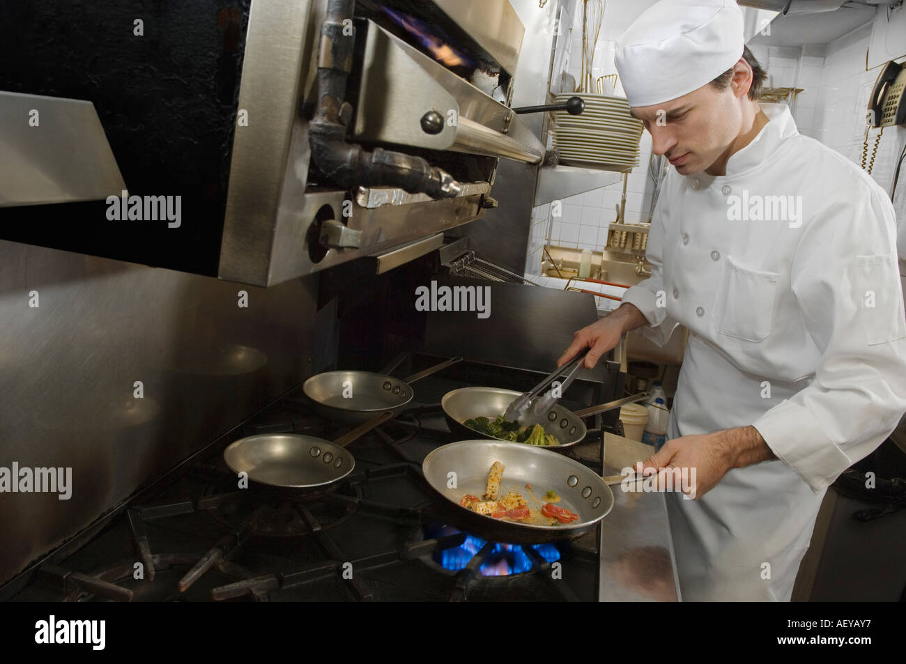 Male chef in restaurant kitchen Stock Photo - Alamy