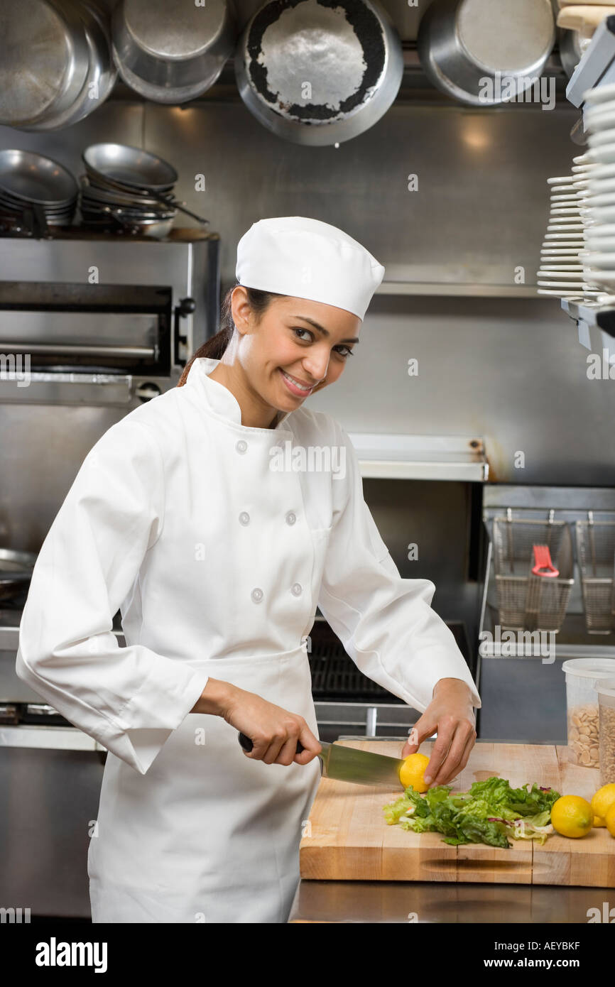 Female chef in restaurant kitchen Stock Photo - Alamy