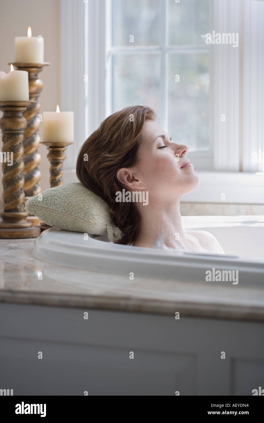 Woman relaxing in bathtub Stock Photo - Alamy