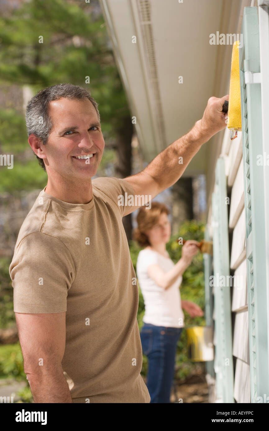 Man painting exterior of house Stock Photo - Alamy