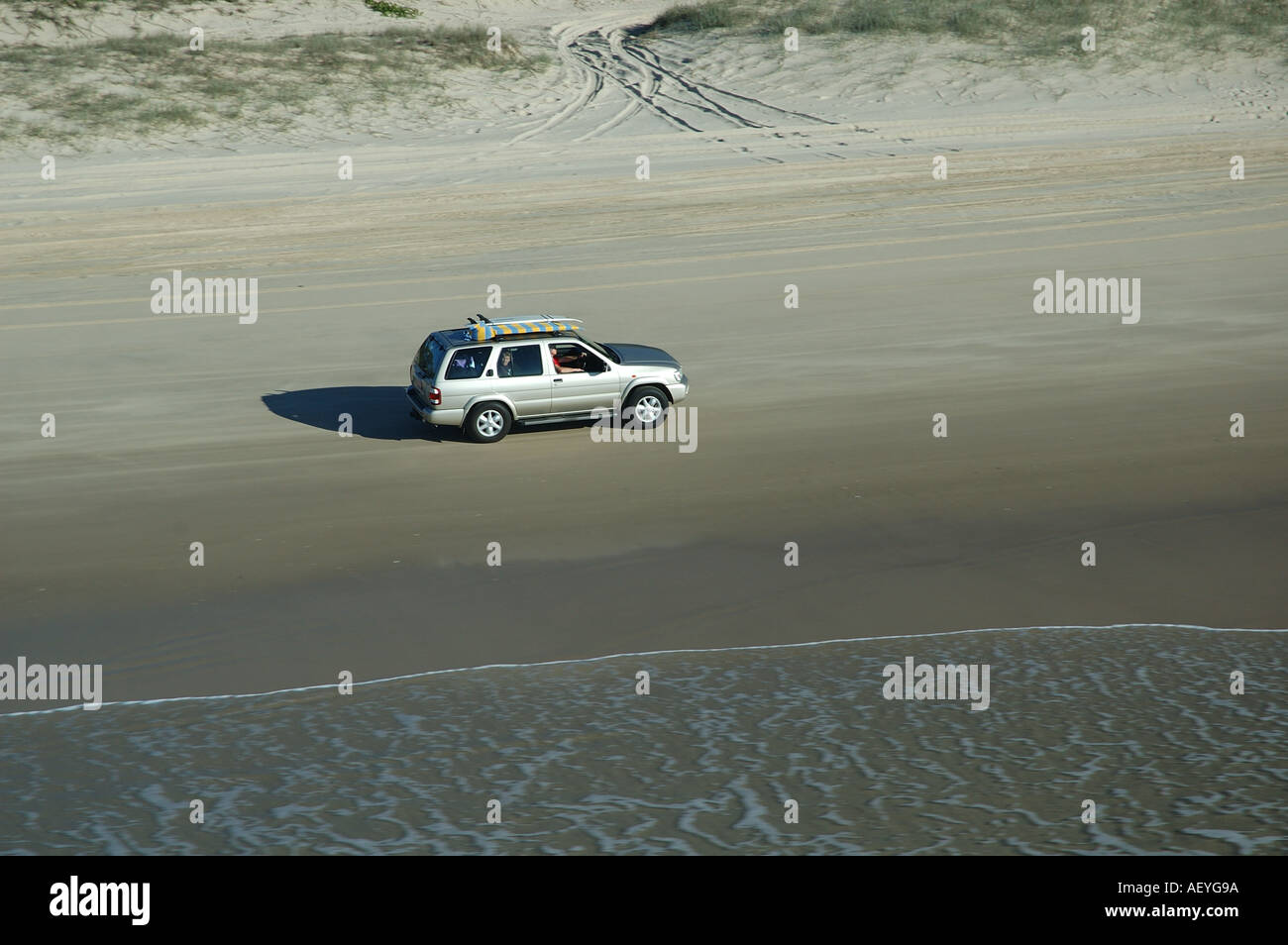 Silver 4WD on beach north of Noosa Queensland Australia Stock Photo - Alamy