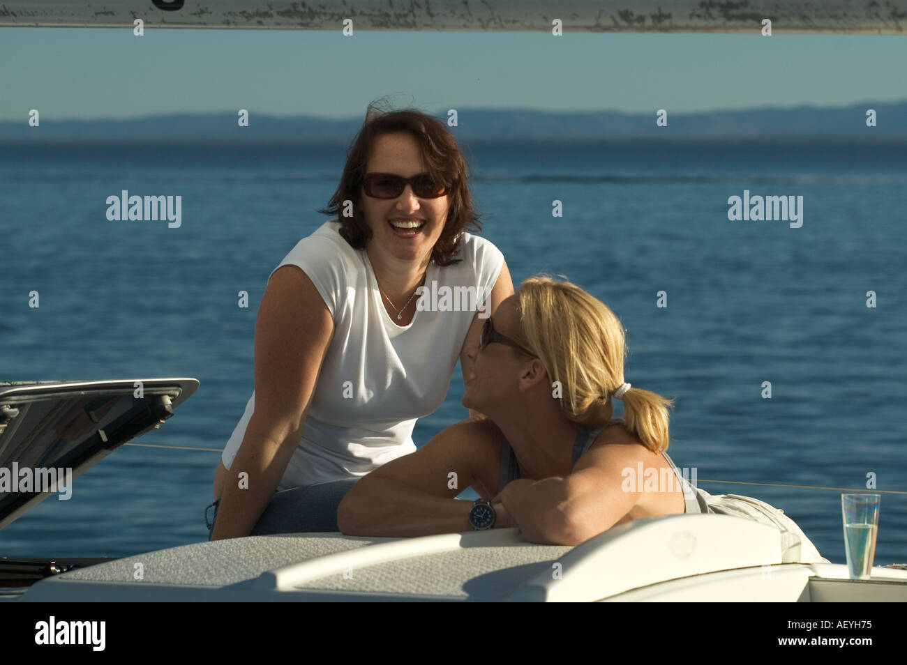 friends chill out on Yacht Stock Photo - Alamy