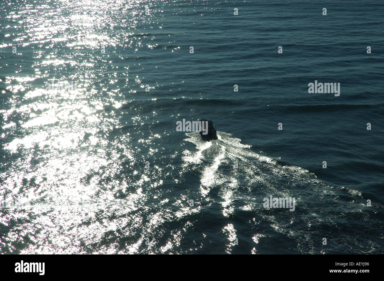 small boat heading out to sea Stock Photo - Alamy