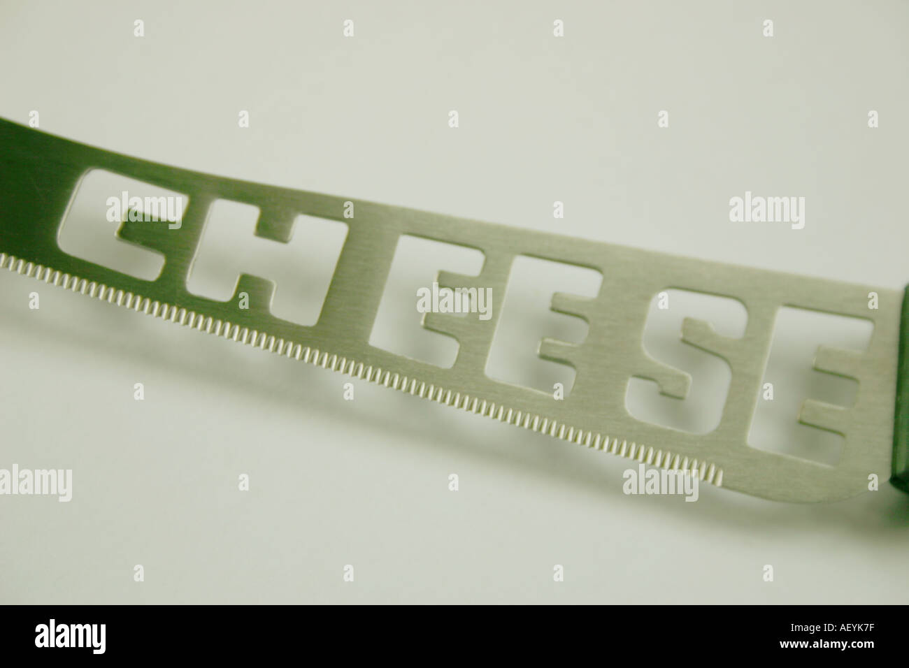 Cheese knife with text Stock Photo - Alamy