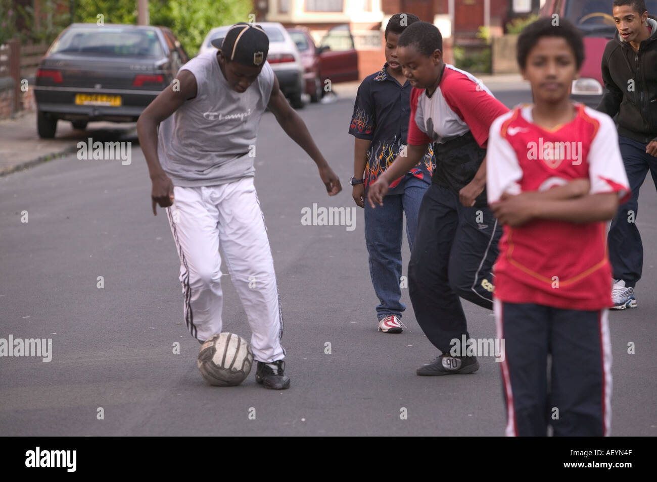children playing football on the street in Beeston Leeds Stock Photo ...
