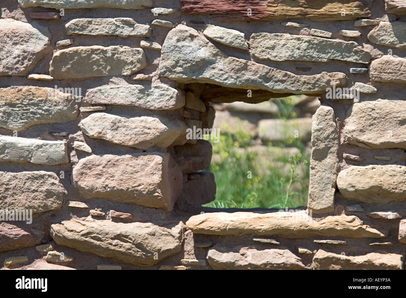 looking through an indian ruin window into the room inside tight ...