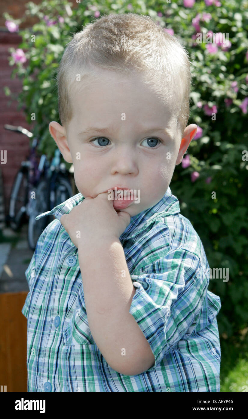 Sad child looking away from camera Stock Photo - Alamy