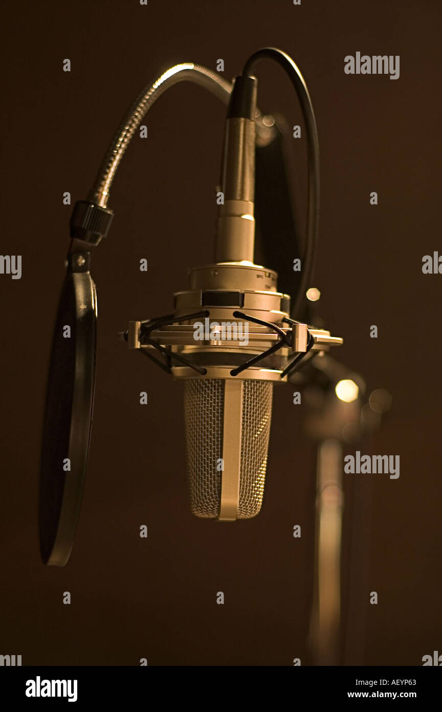 Studio microphone mounted in a spring loaded shock mount centered ...
