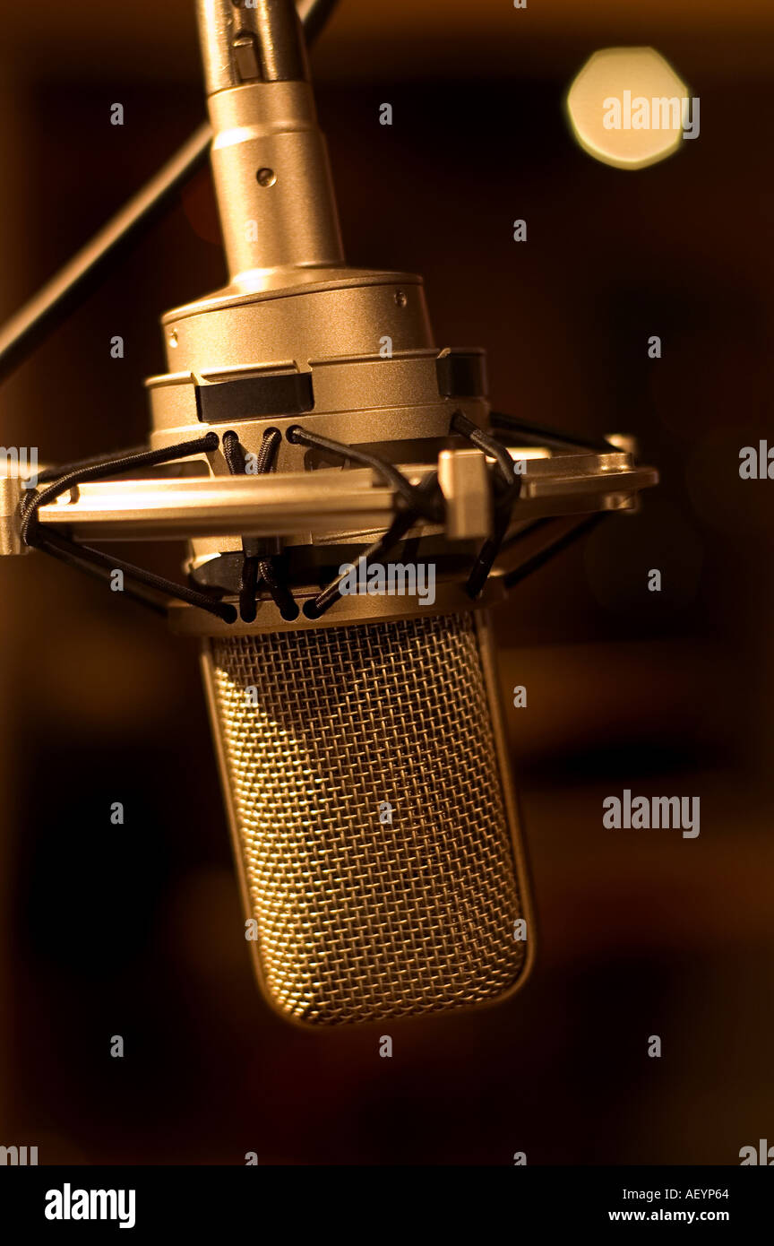 Studio microphone mounted in a spring loaded shock mount framed left ...