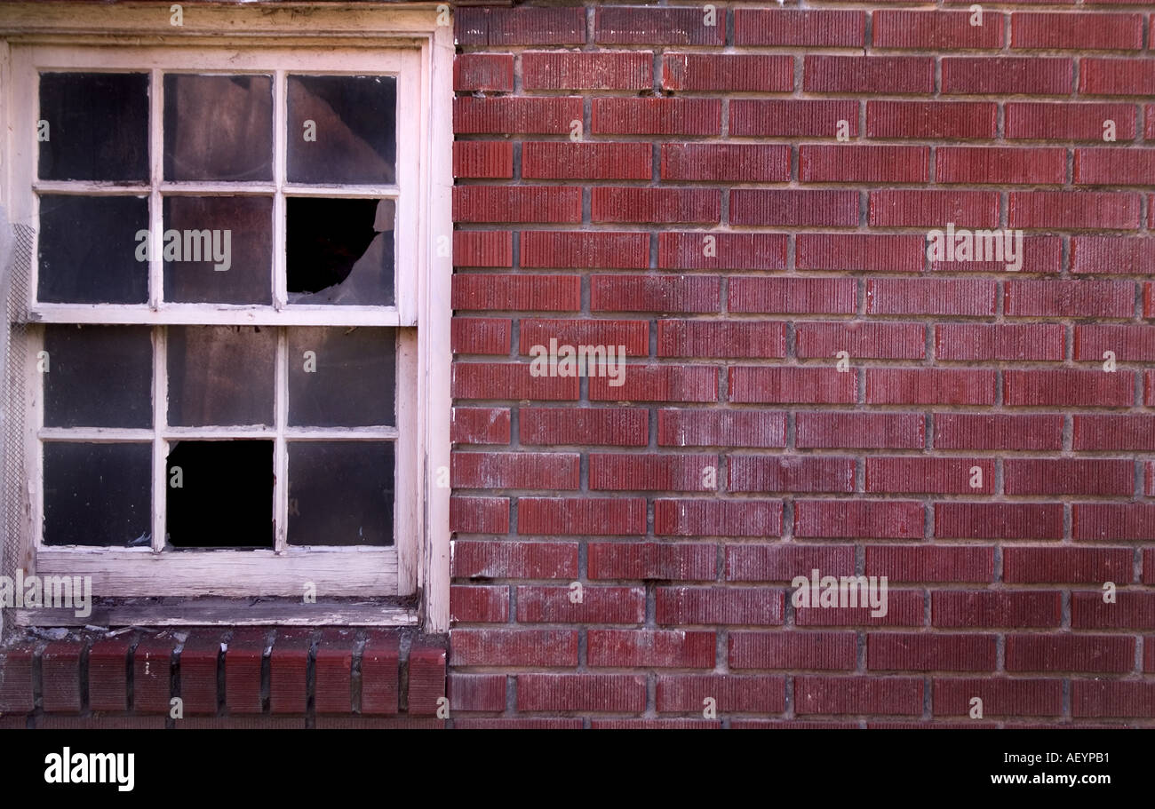 White pane window with broken panes set to the left of this photo of an ...