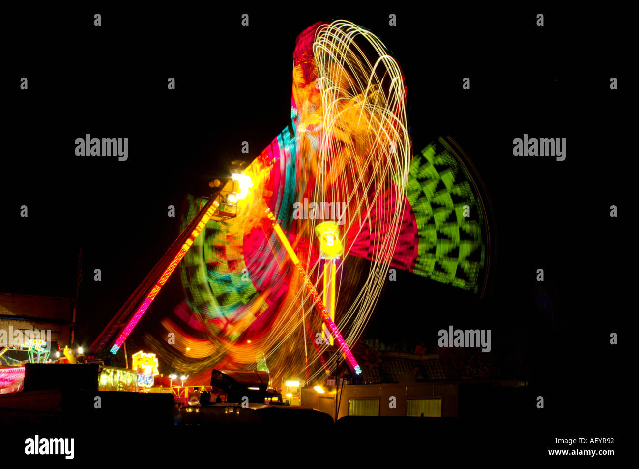 Light trails from funfair rides at night Stock Photo - Alamy