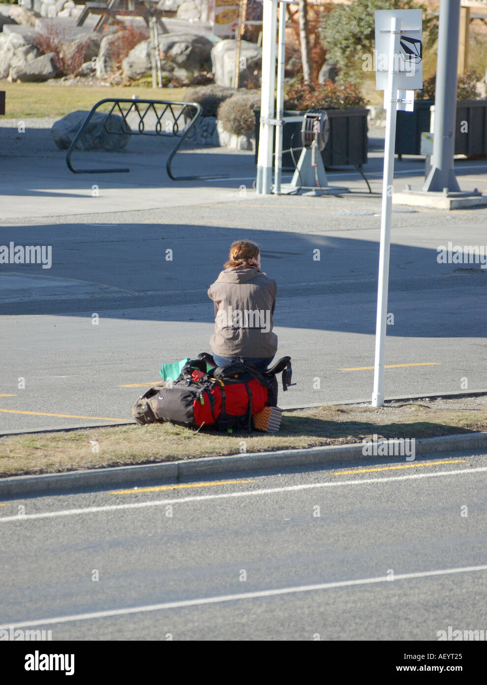 Girl at a bus stop Stock Photo - Alamy