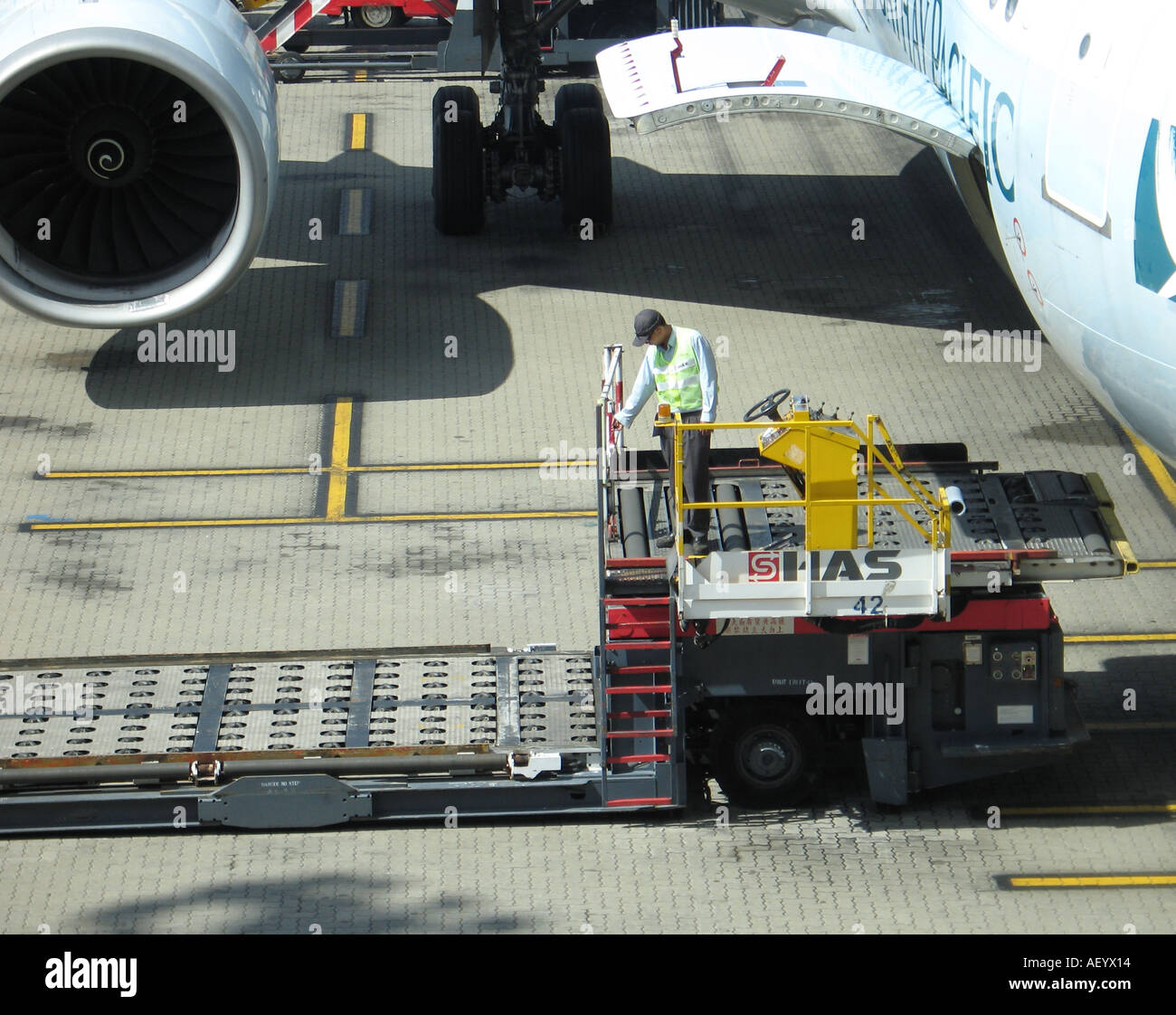 Airport baggage loader Stock Photo - Alamy
