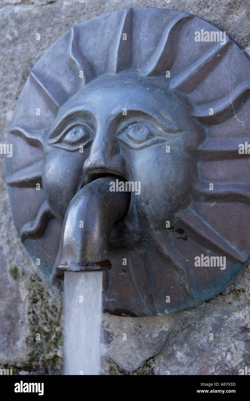 Sun faced drinking fountain Stock Photo - Alamy