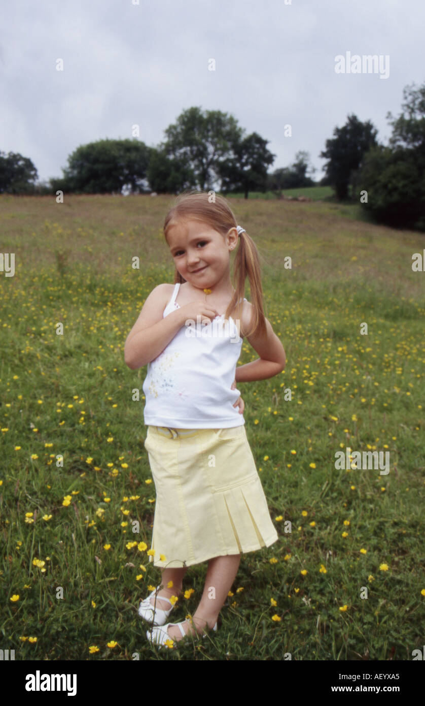 Hand on hip with buttercup number 2227 Stock Photo - Alamy