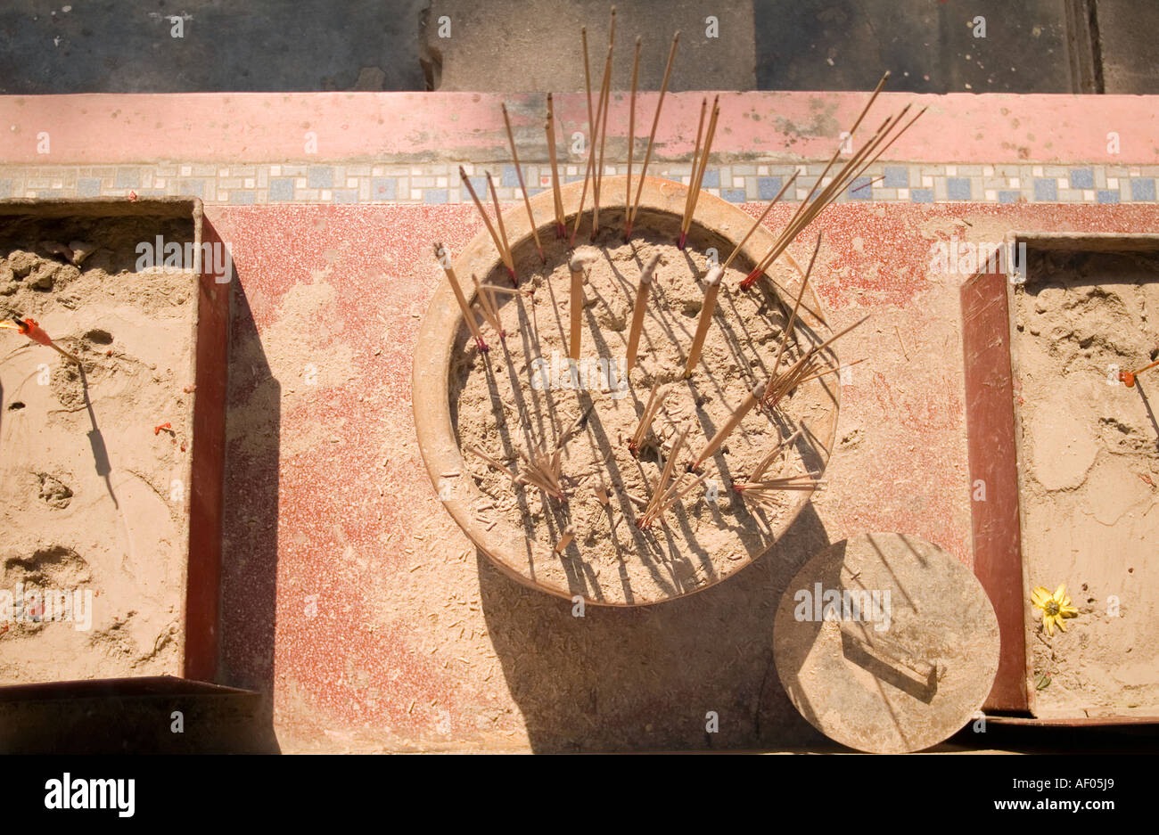 Incense placed at a praying pot in a chinese temple during the Chinese ...