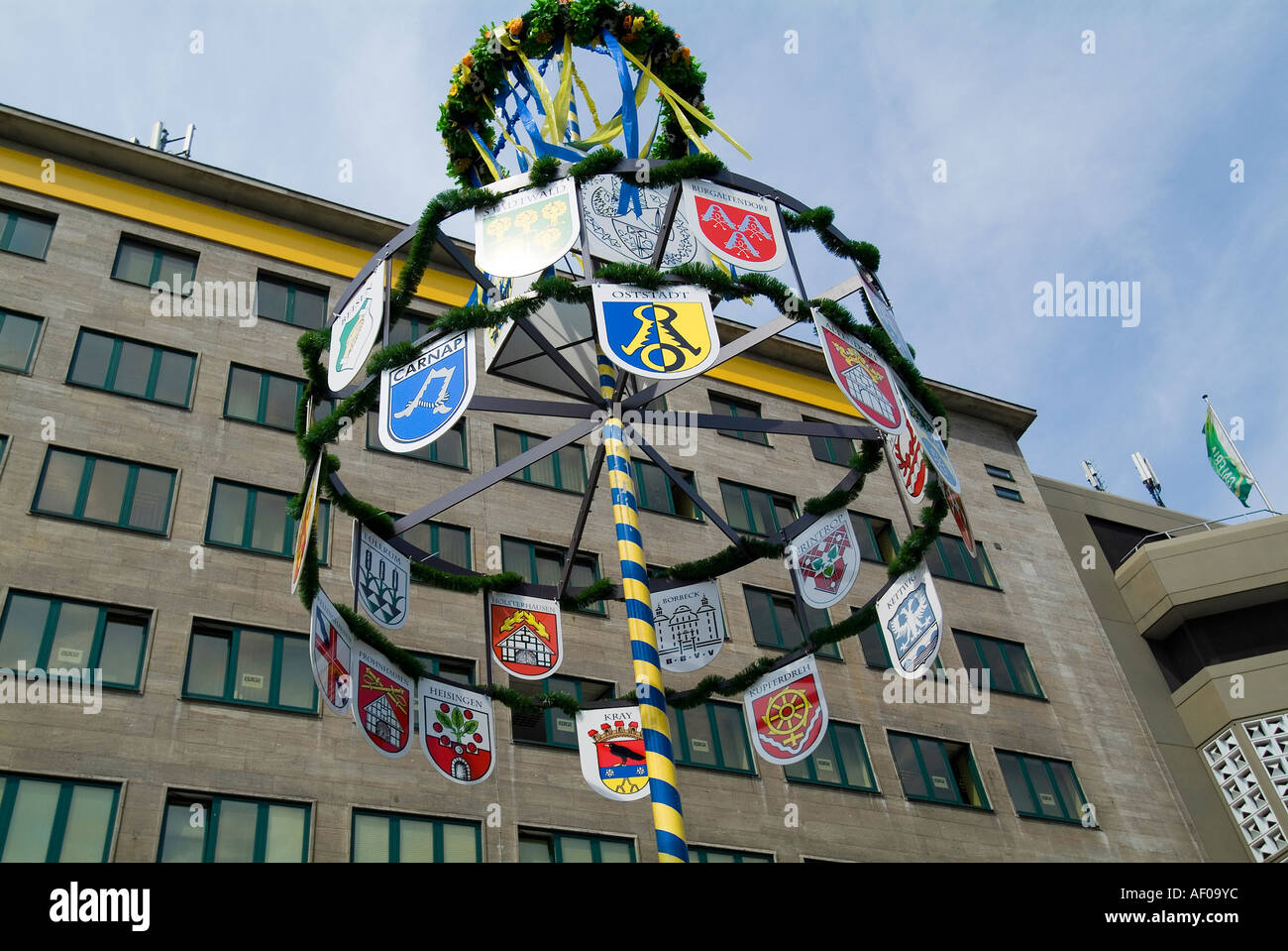 emblems of the different parts of the town Essen hanging on a decorated ...