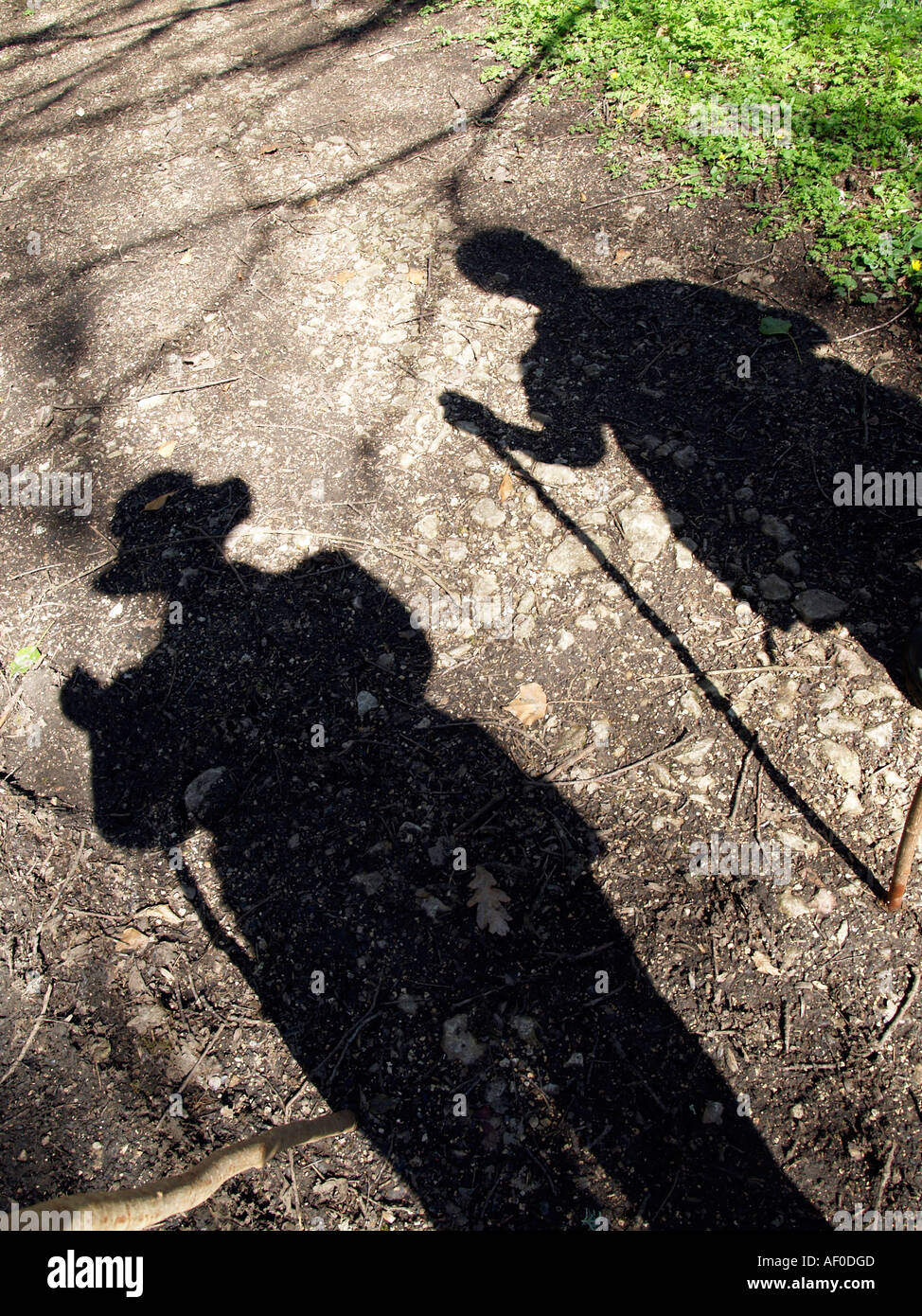 MR shadow of two persons by hiking walking on a treck Stock Photo - Alamy