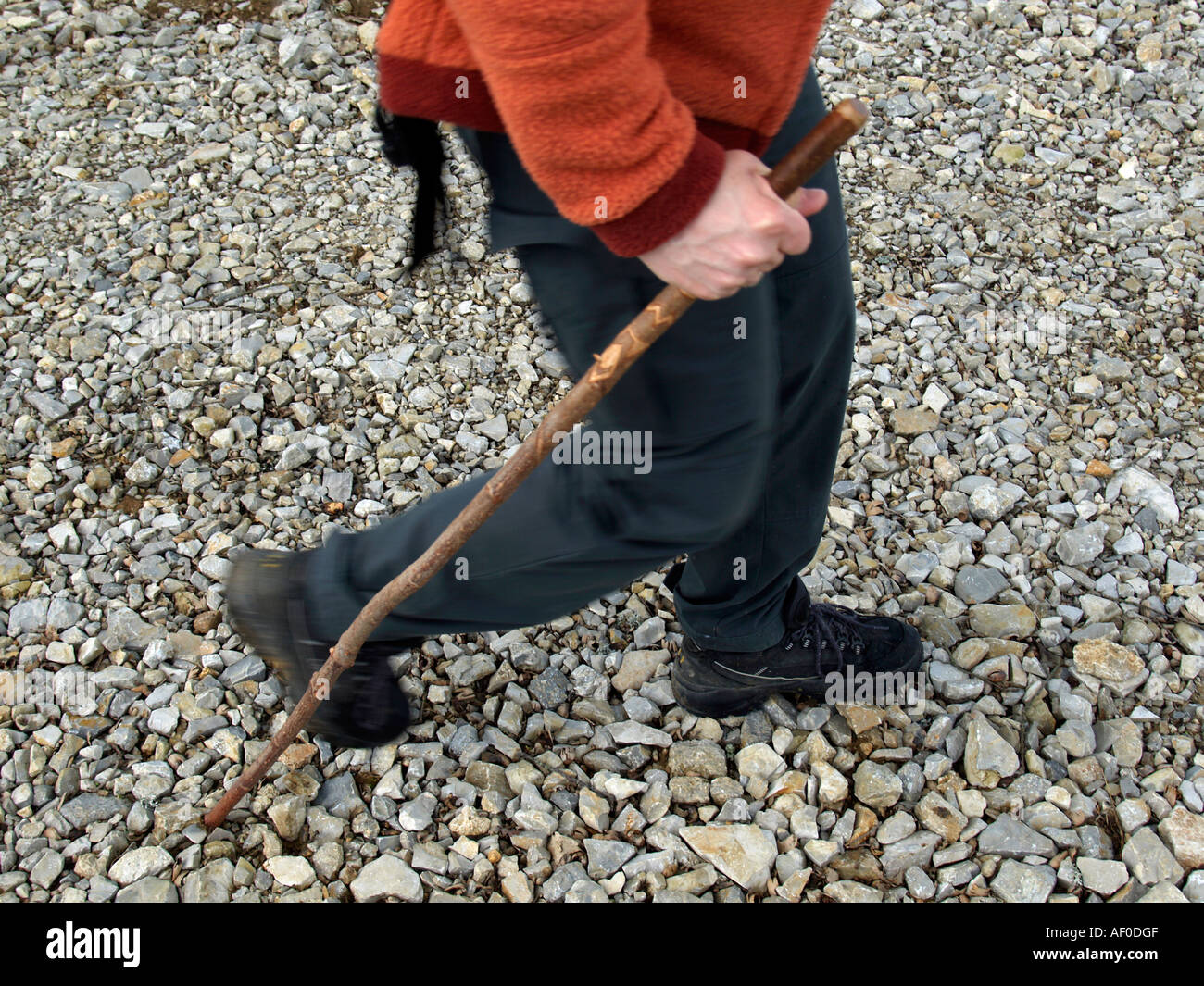 MR hiking walking on a track road path over stones scree with walking ...