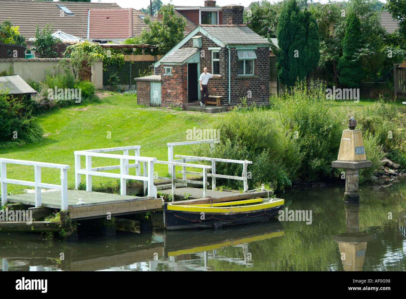 Rowing boat ferry across manchester ship canal Lancashire England UK ...