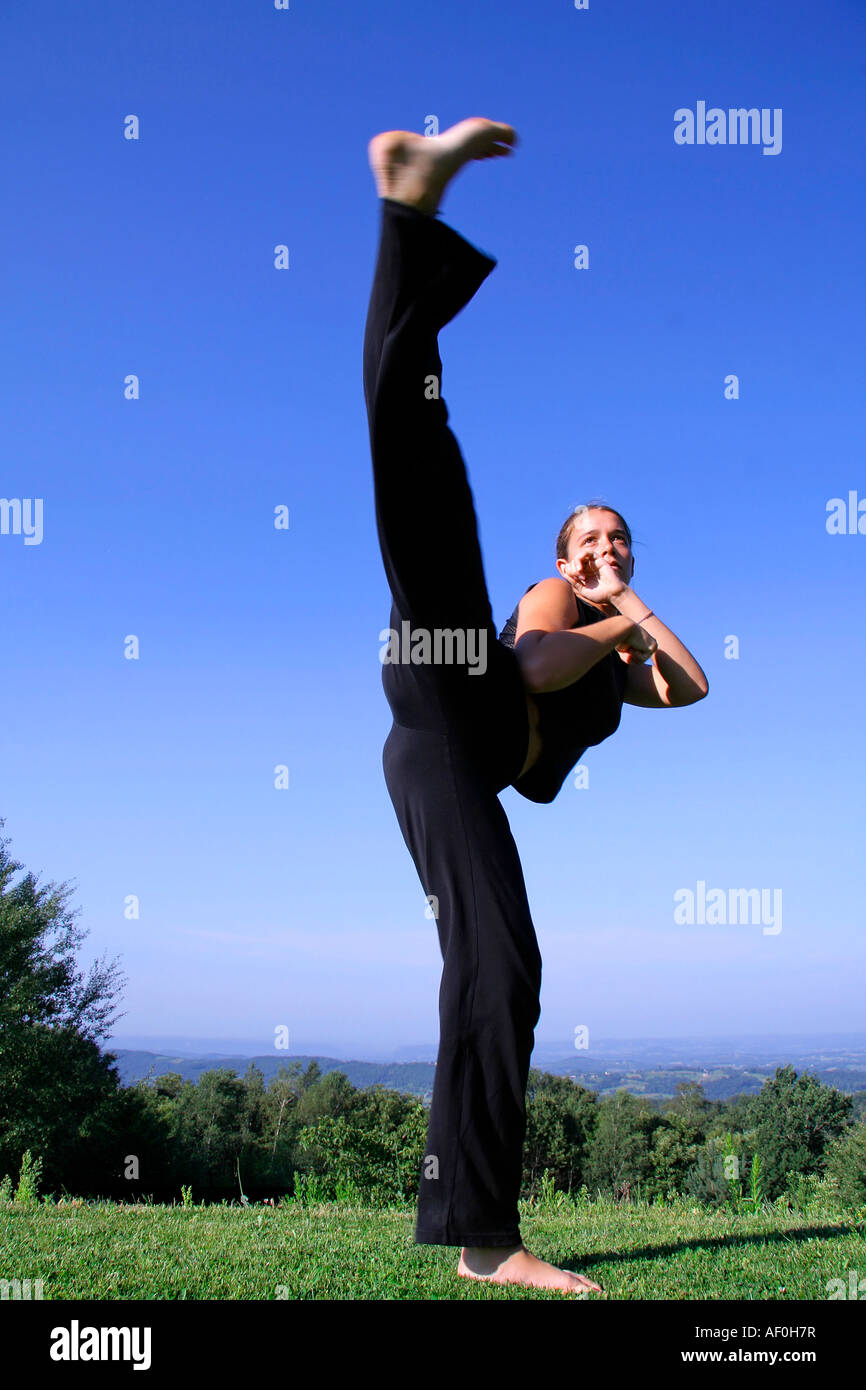 high split kick attractive young woman practising self defense Stock ...