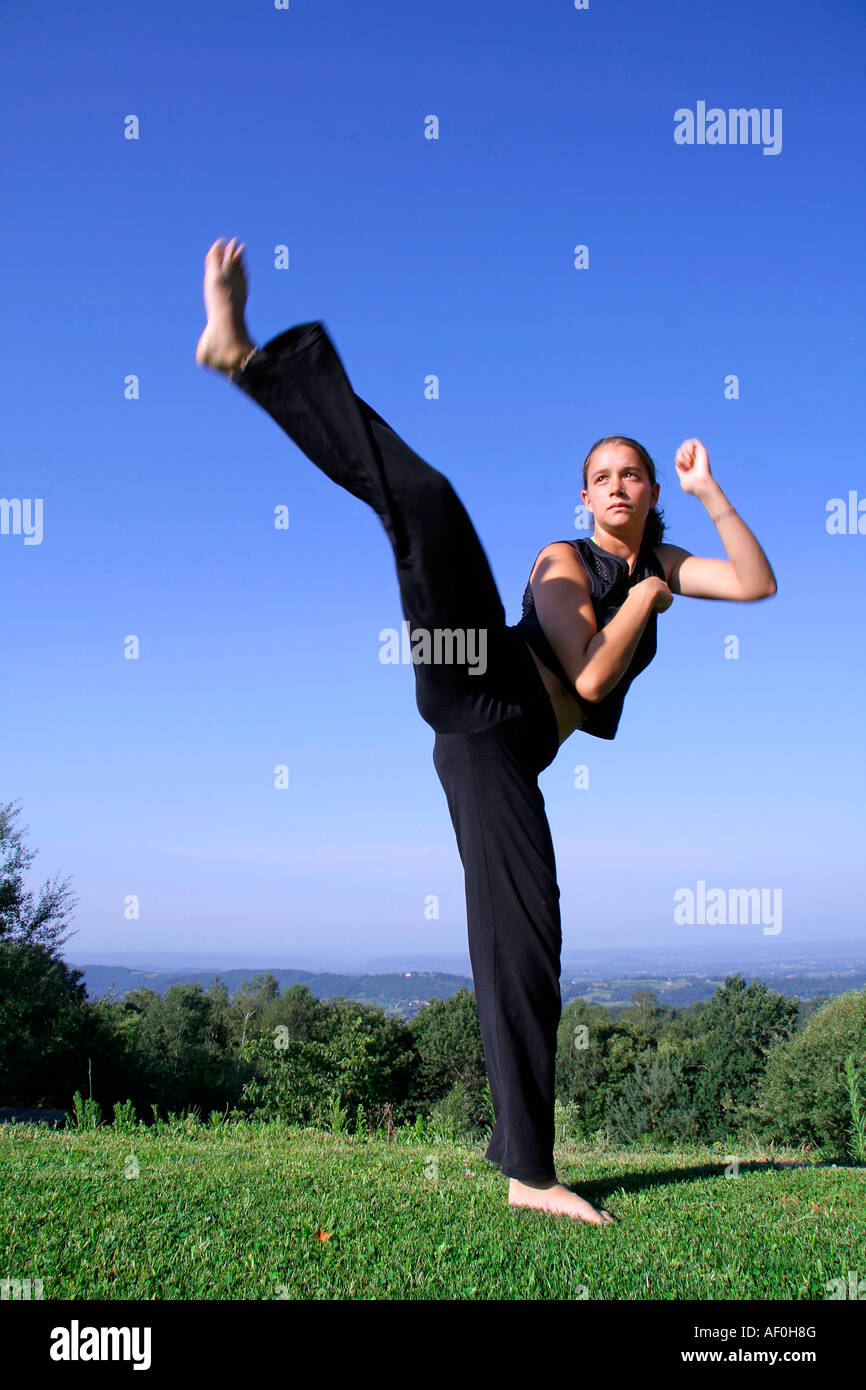 rotation kick attractive young woman practising self defense Stock ...