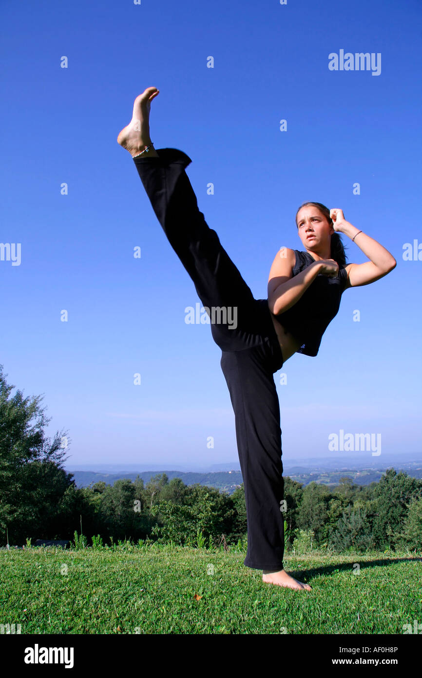 split kick attractive young woman practising self defense Stock Photo ...