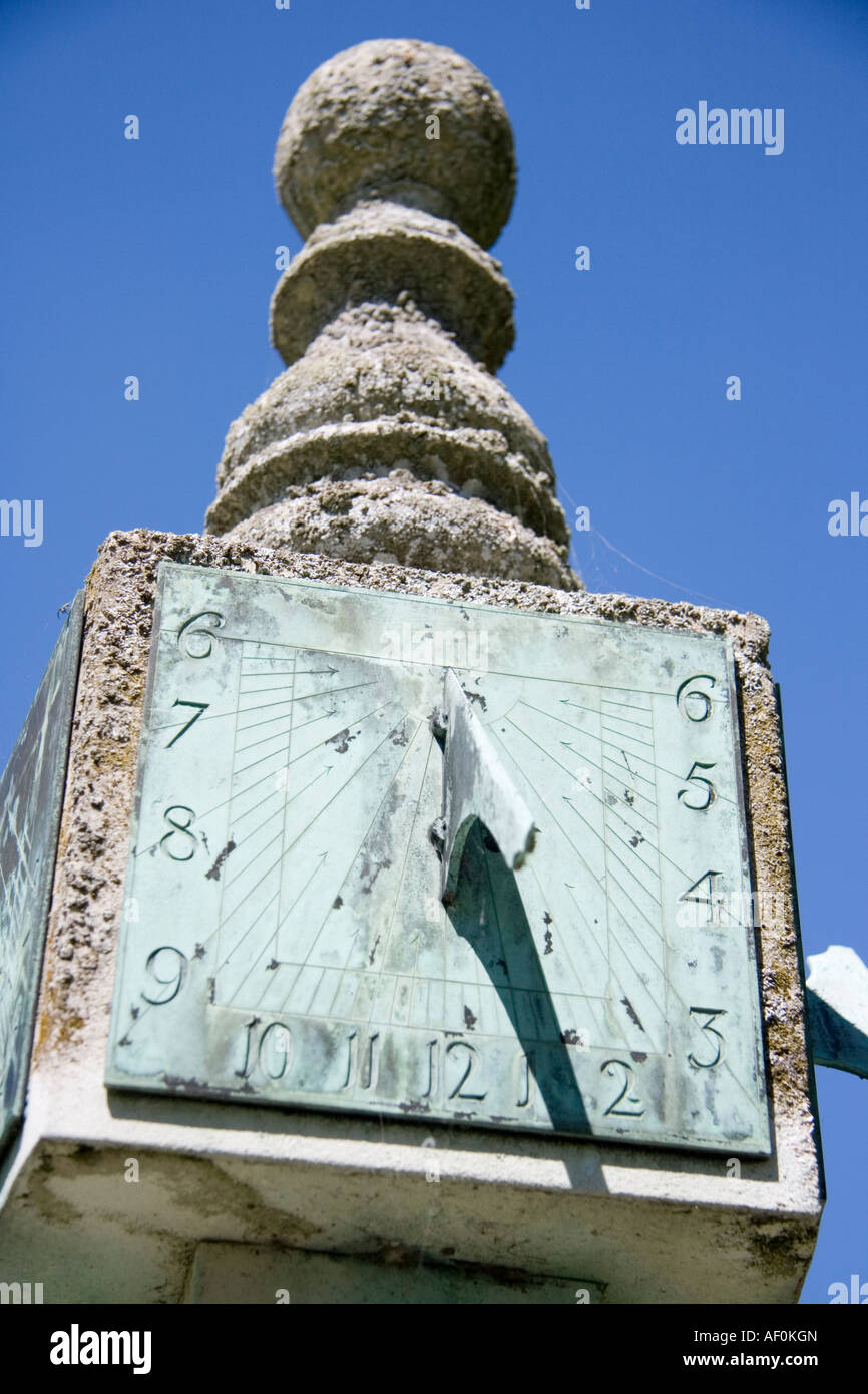 horizontal sundial on granite pillar with blue sky Stock Photo - Alamy