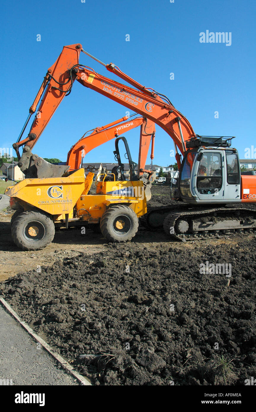Mechanical digger on new build executive housing estate in West ...