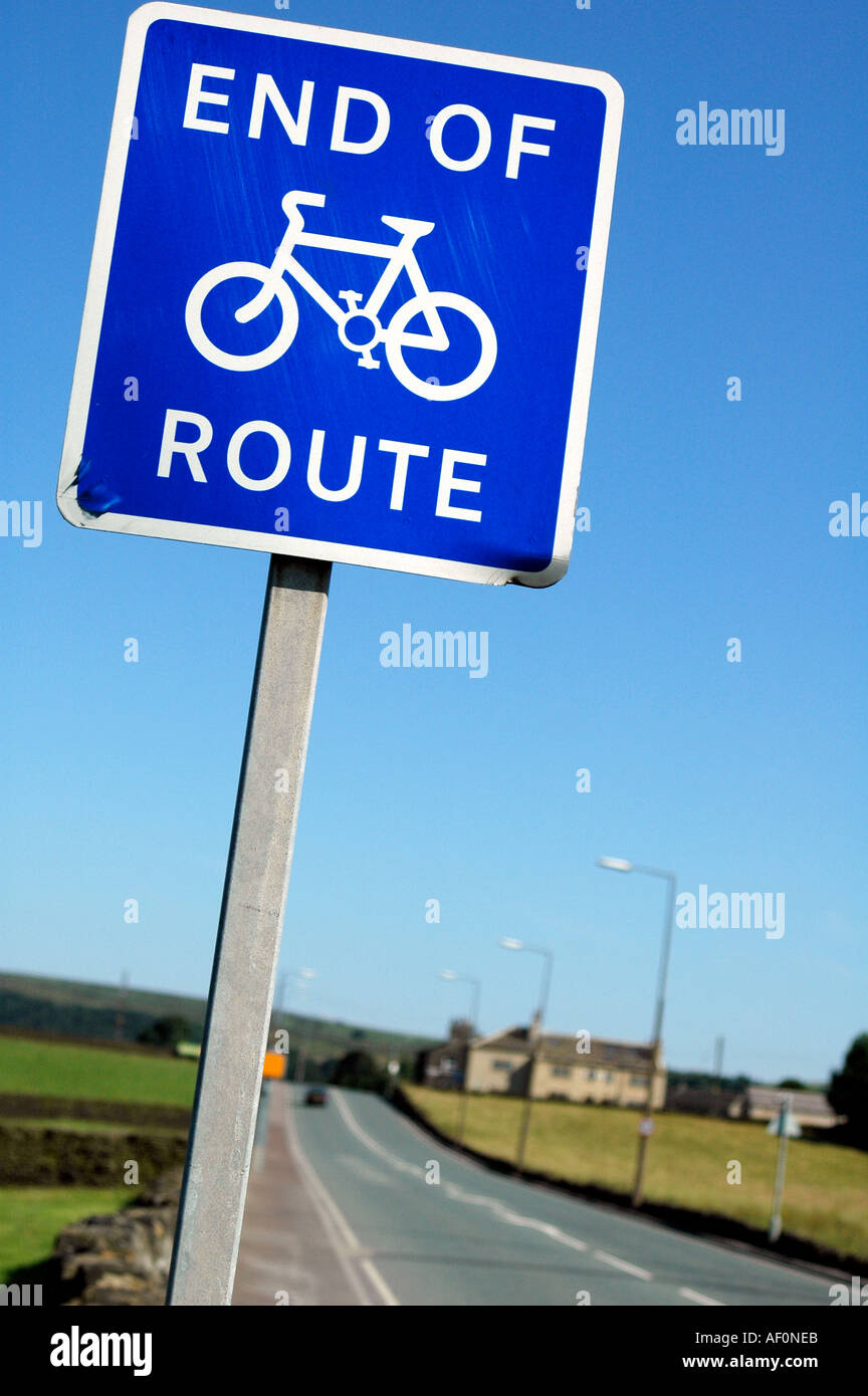 Blue square road sign displaying end of cycle lane Stock Photo - Alamy
