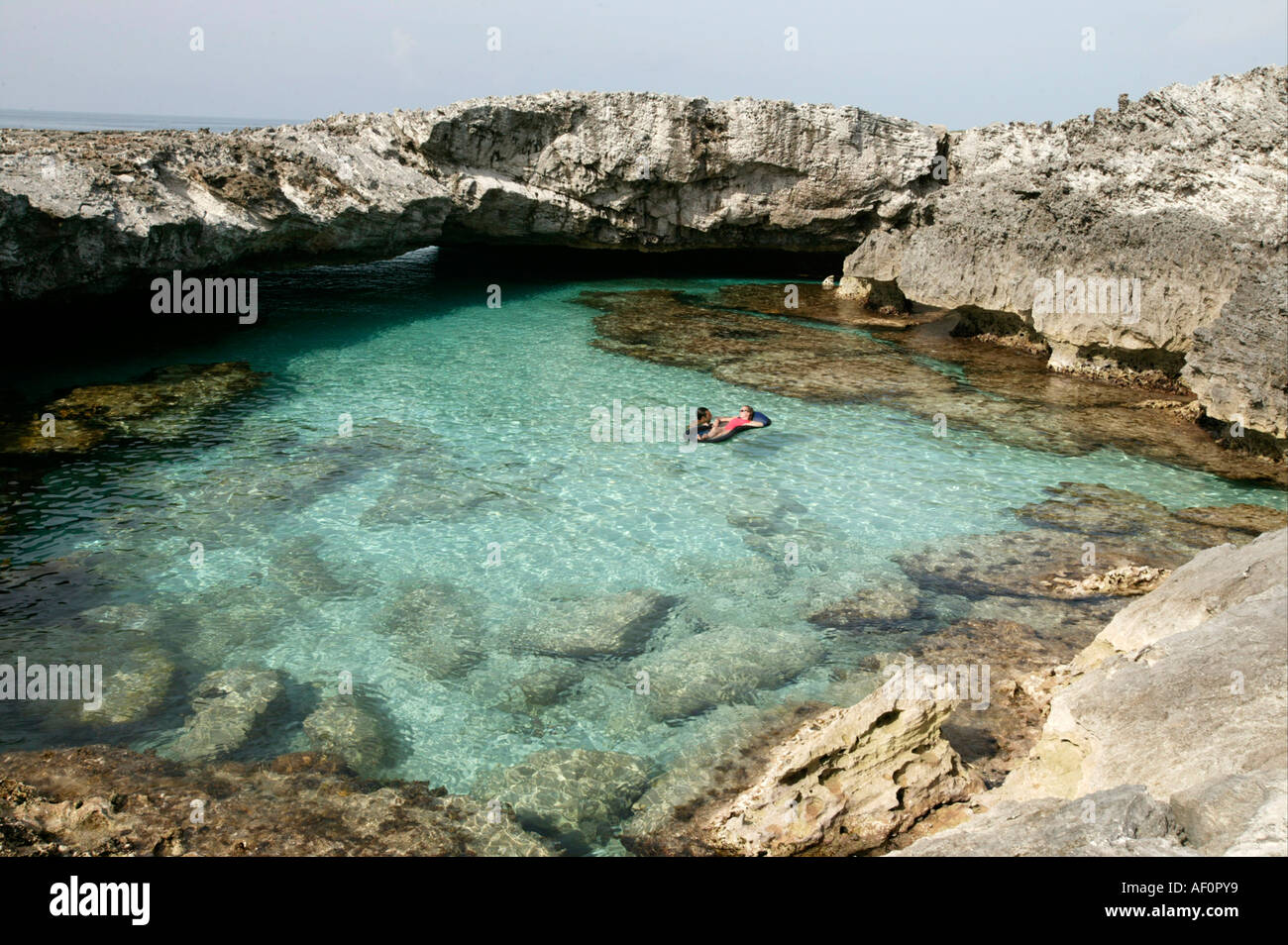 Couple with float Swimming Pool aka Swimming Hole Muertos Cay Cay Sal ...