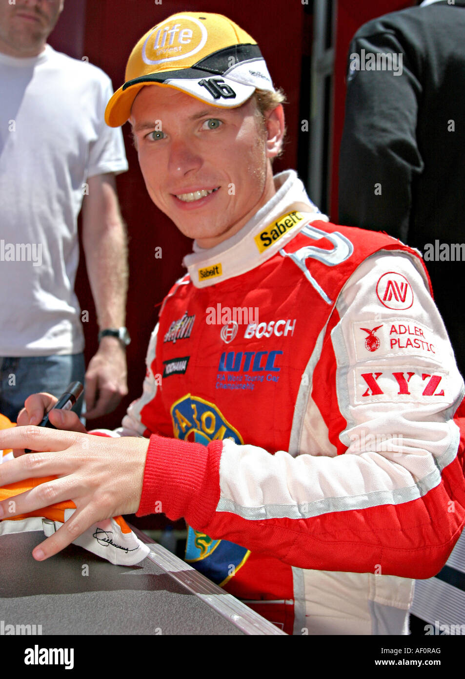 pilot giving autographs on caps Stock Photo - Alamy