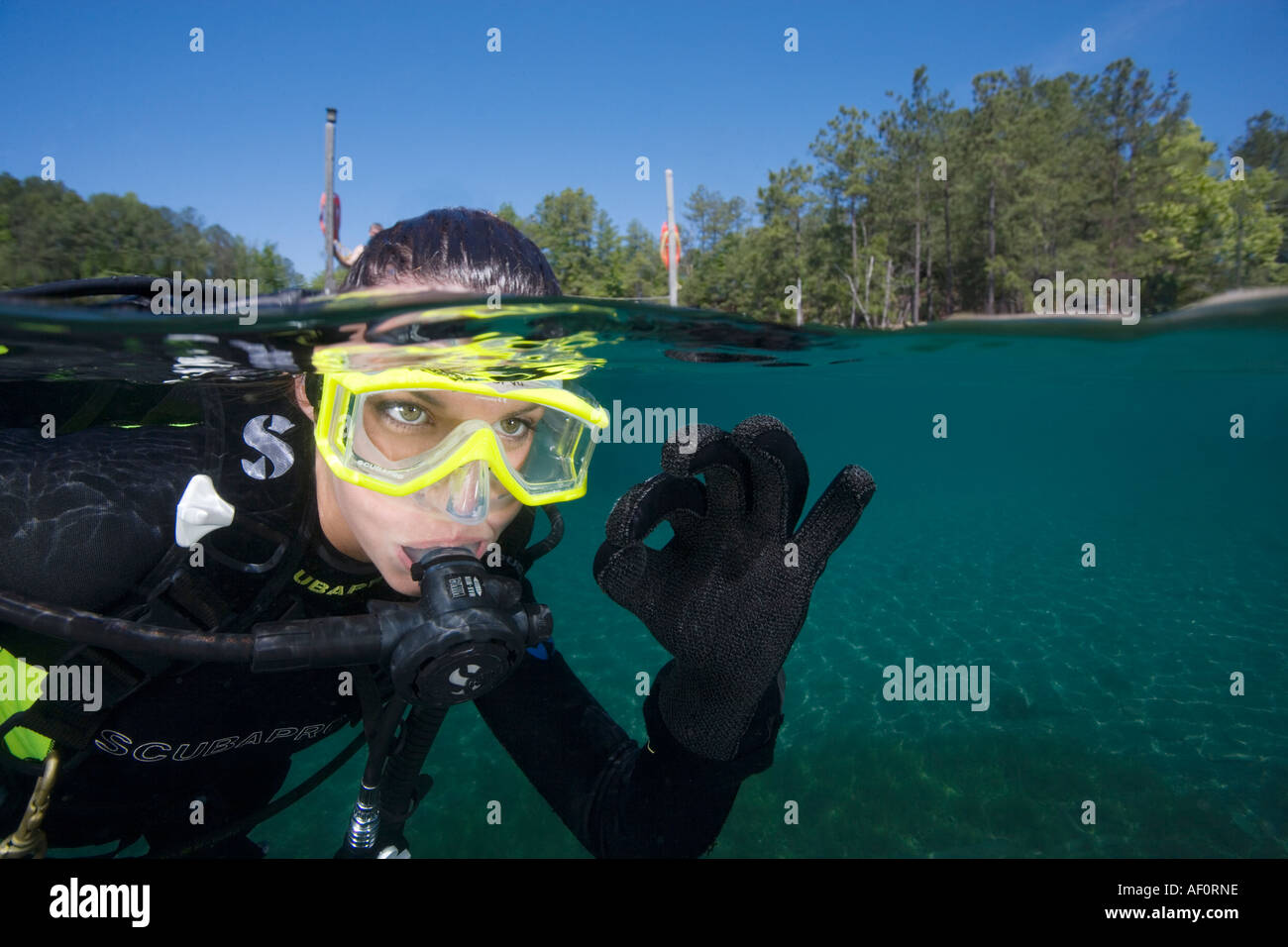 Under over of woman scuba diver giving okay sign Lake Rawlings Rawlings ...