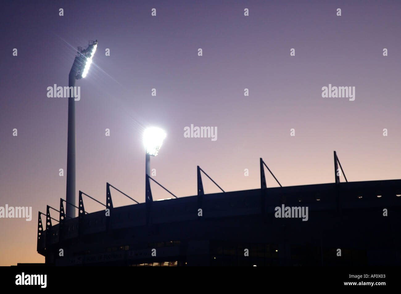 Stadium lights at dusk Stock Photo - Alamy