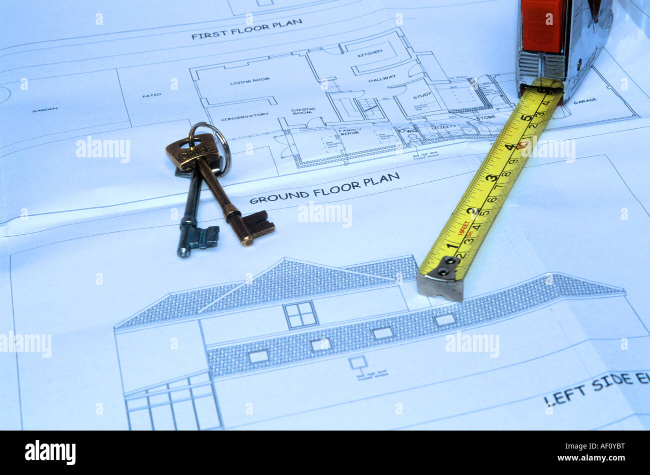 Building plans with keys and tape Stock Photo - Alamy
