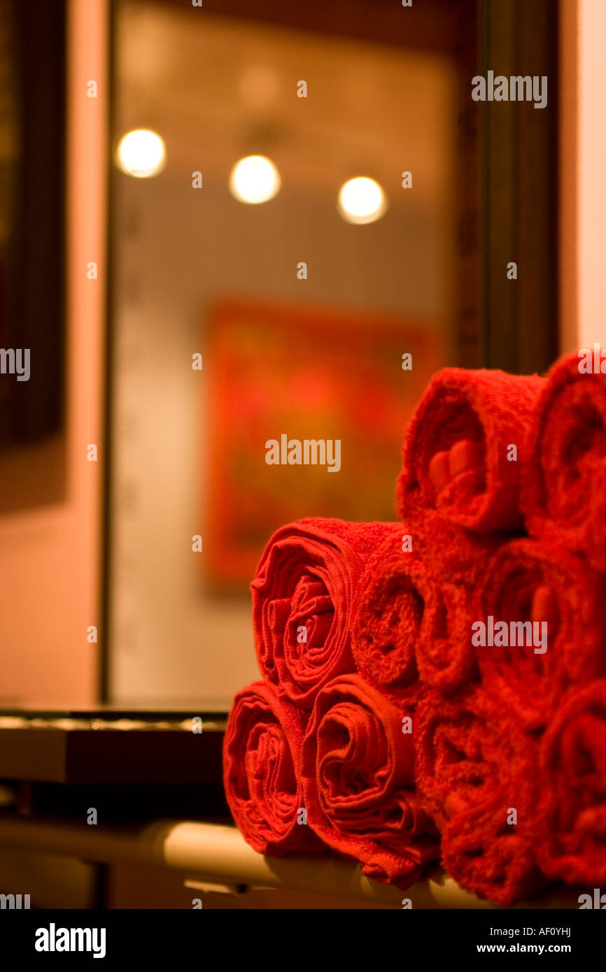 Stack of red towels in a beauty salon Stock Photo - Alamy