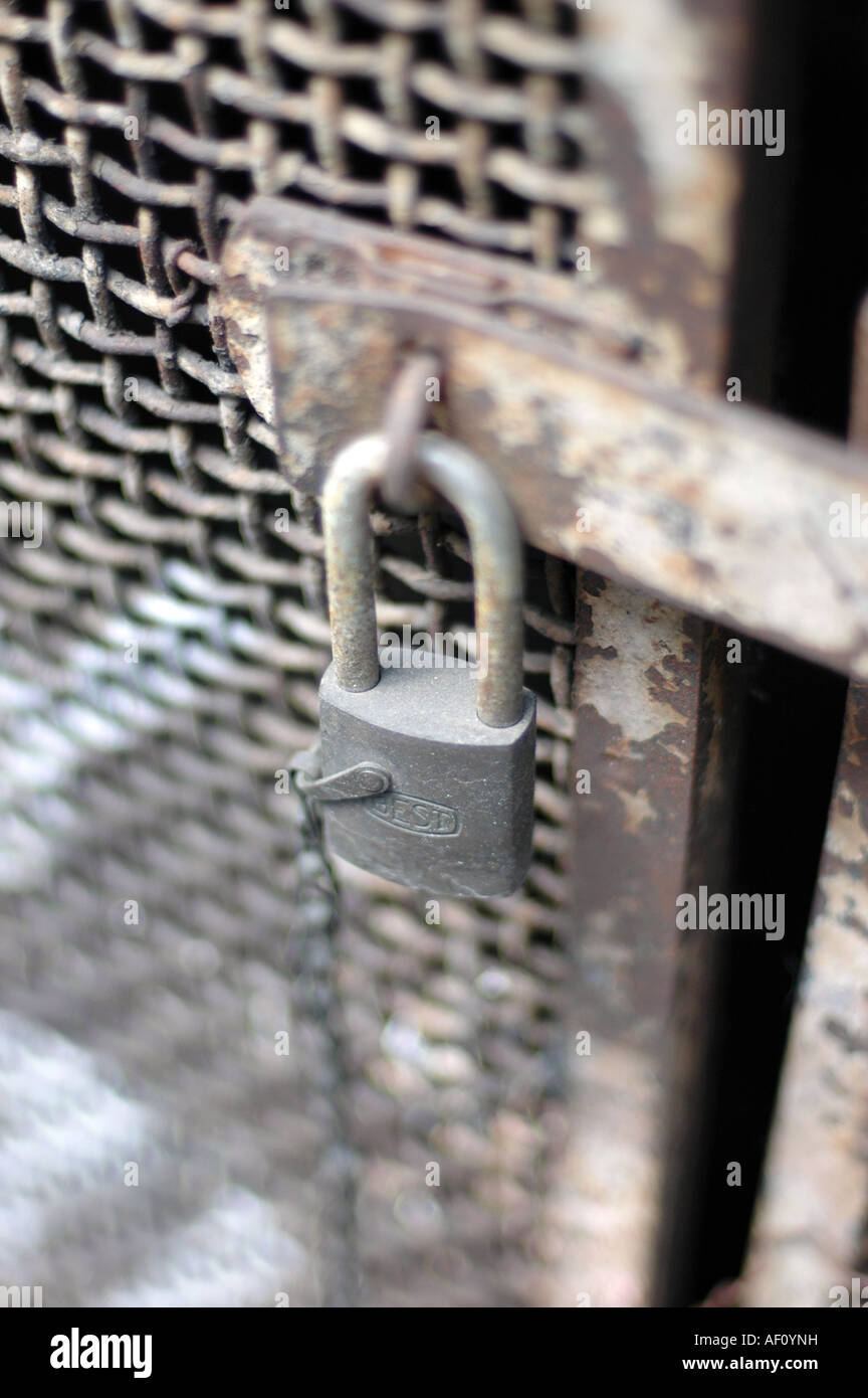 Steel lock on the door of a rusted gate Stock Photo - Alamy