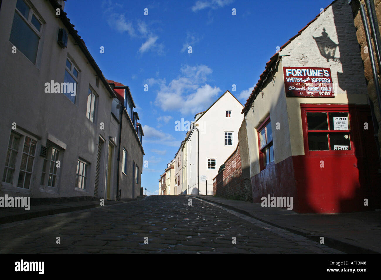 Back streets of Whitby, kippers, shop, houses, whitewashed Stock Photo ...