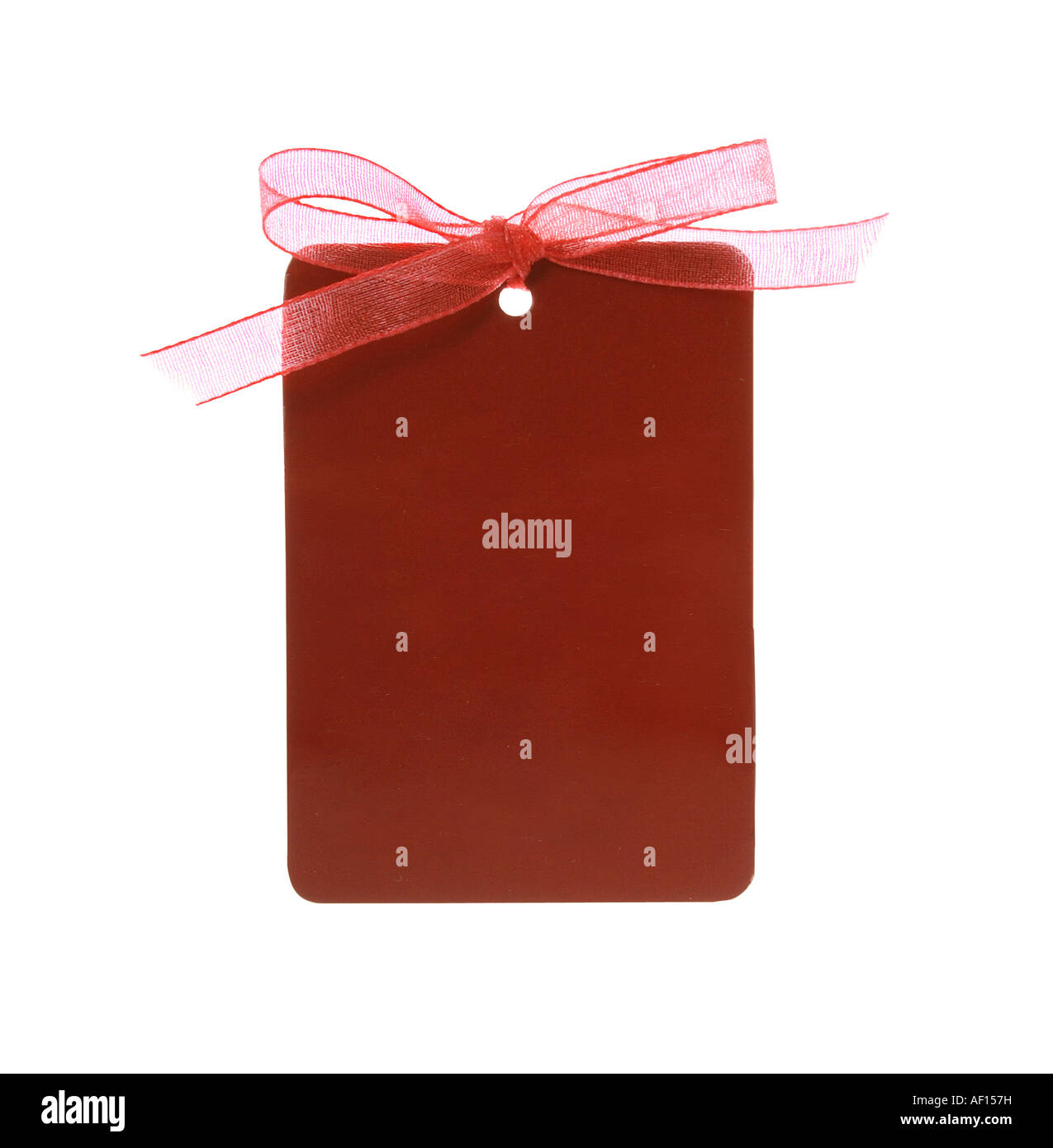 A red blank gift tag tied with red satin ribbon on white background ...