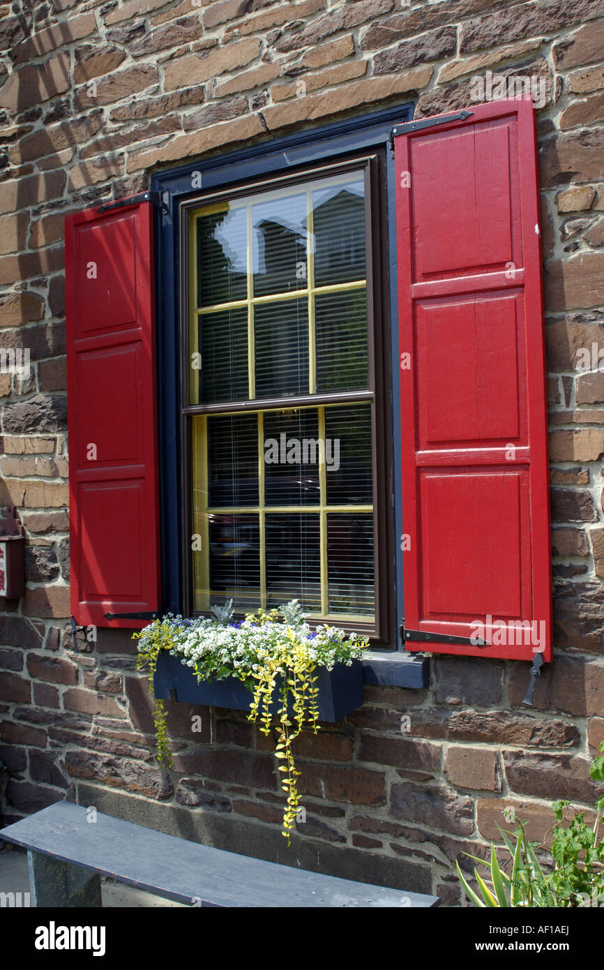 Colonial style window with flower box and red Shutters in Pennsylvania ...
