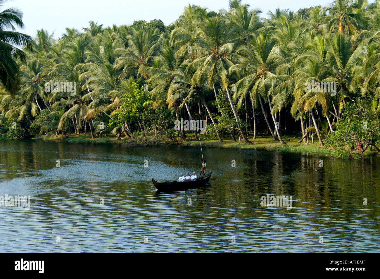 COUNTRY BOAT RIDE BY TOURISTS IN THIRUVALLAM NEAR TRIVANDRUM Stock ...