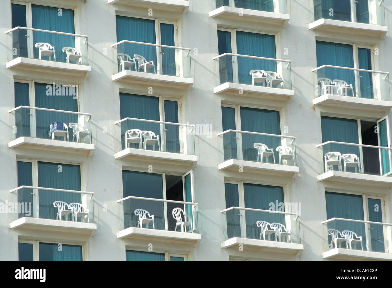 multiple window pattern on hotel facade Stock Photo - Alamy