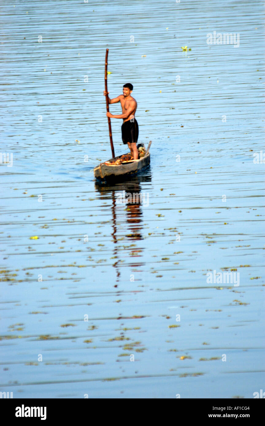 MAN ON COUNTRY BOAT AKKULAM THIRUVANANTHAPURAM Stock Photo - Alamy
