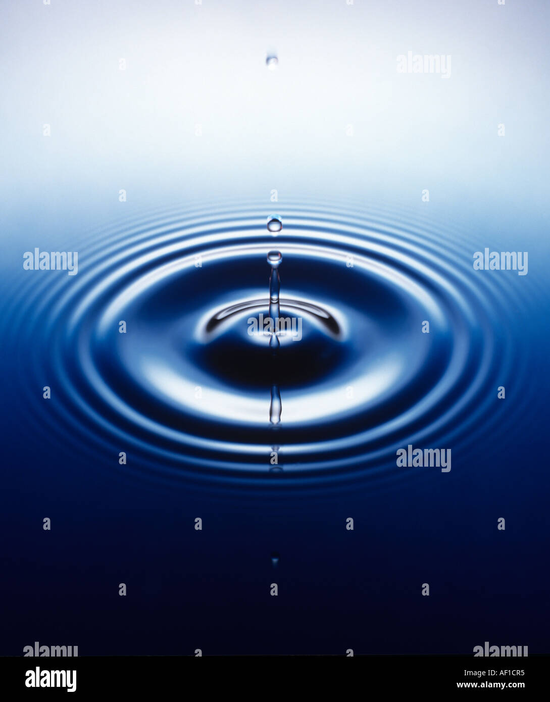 Water droplet and ripples Stock Photo - Alamy