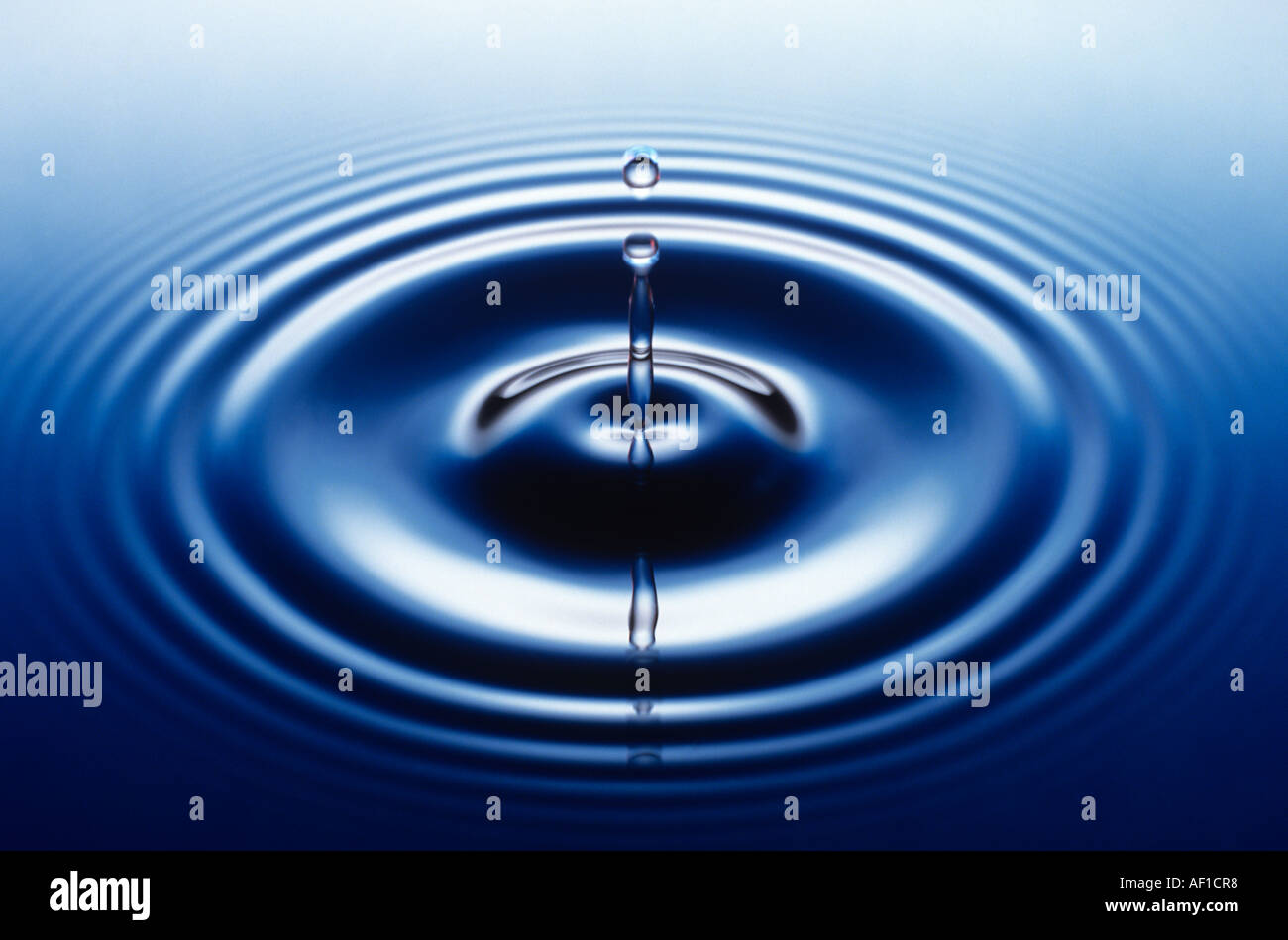 Water droplet and ripples Stock Photo - Alamy