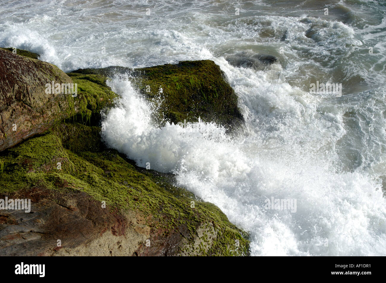 WAVES LASHING AGAINST ROCKS, PULINGUDI BEACH, NEAR KOVALAM Stock Photo ...