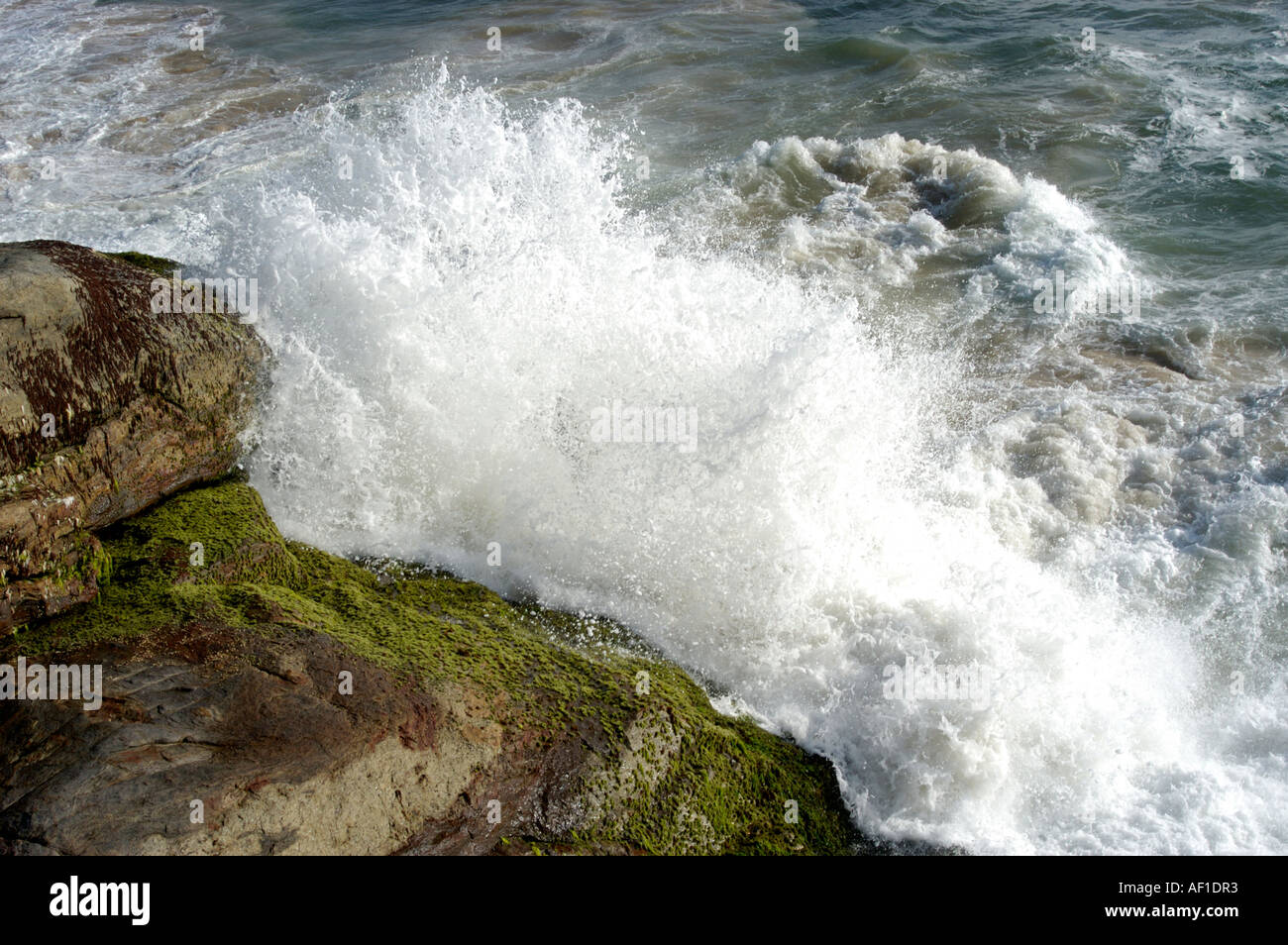 WAVES LASHING AGAINST ROCKS, PULINGUDI BEACH, NEAR KOVALAM Stock Photo ...